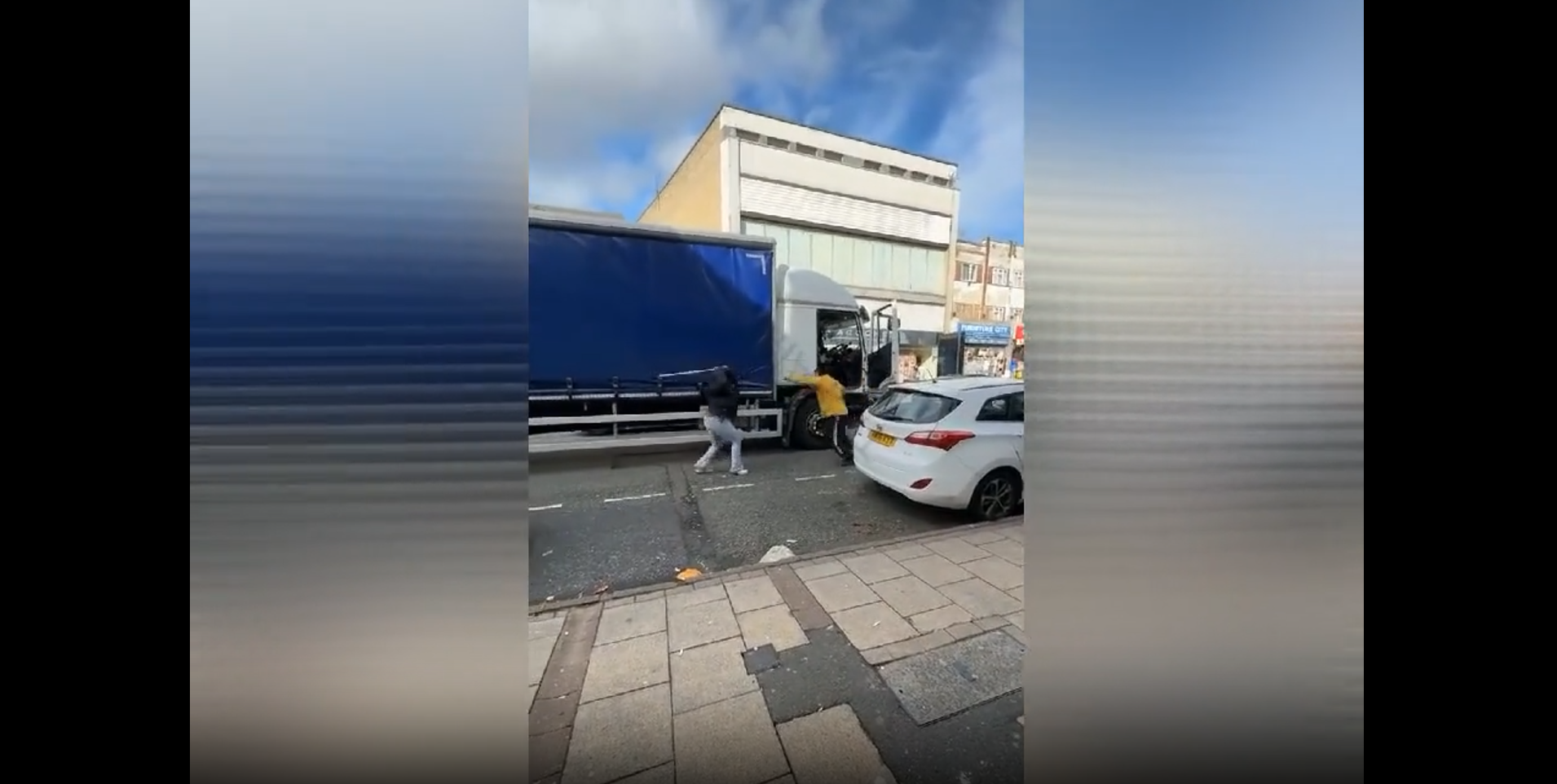 Woman Uses Stick To Wack A Trucker During Road Rage | TrollAlley.com